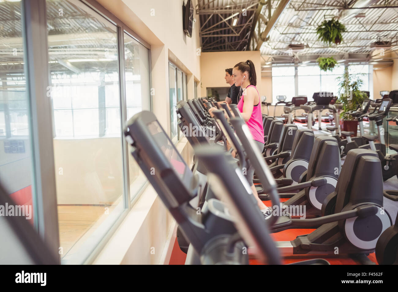 Fit people working out using machines Stock Photo - Alamy
