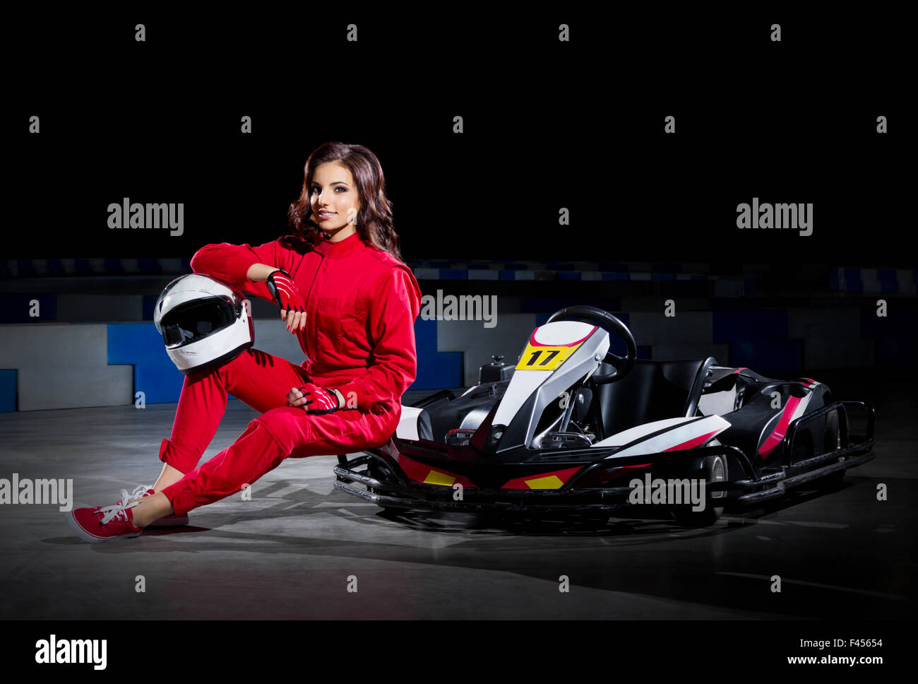 Young girl karting driver isolated Stock Photo - Alamy