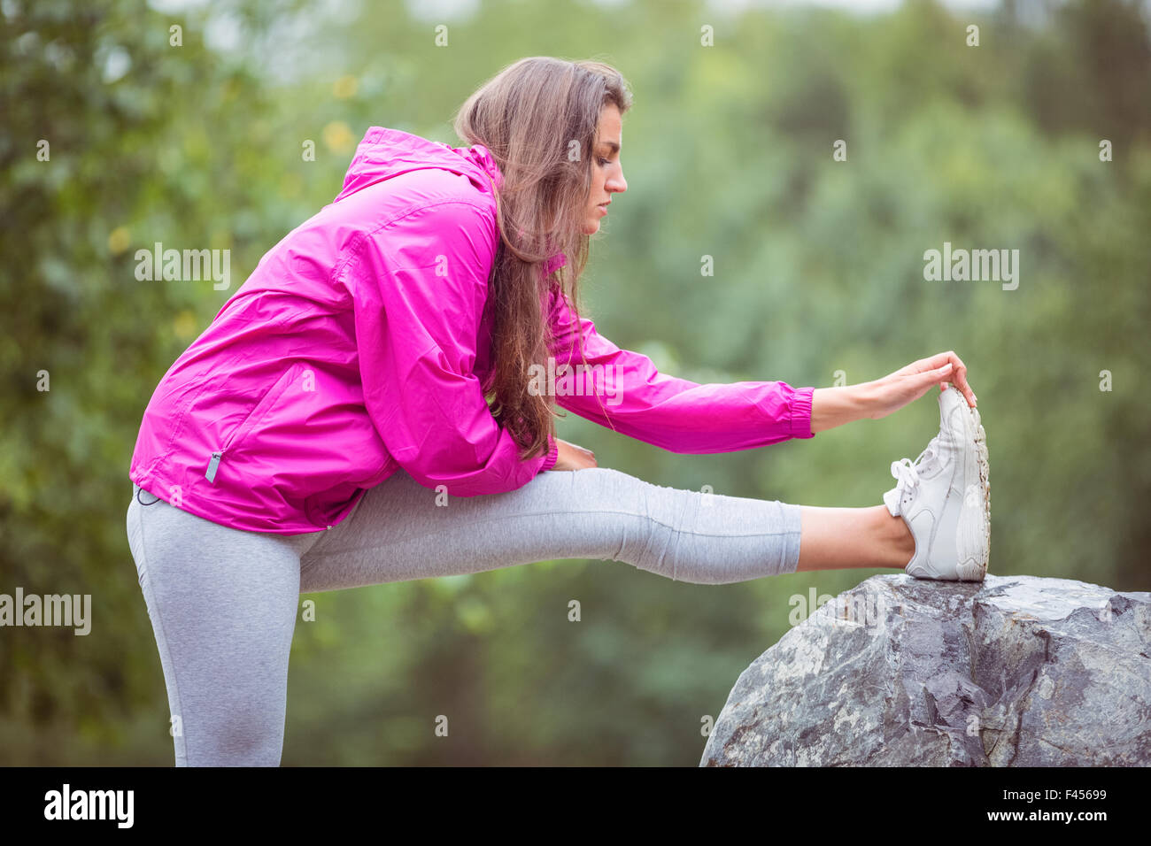 Fit woman stretching her leg Stock Photo - Alamy