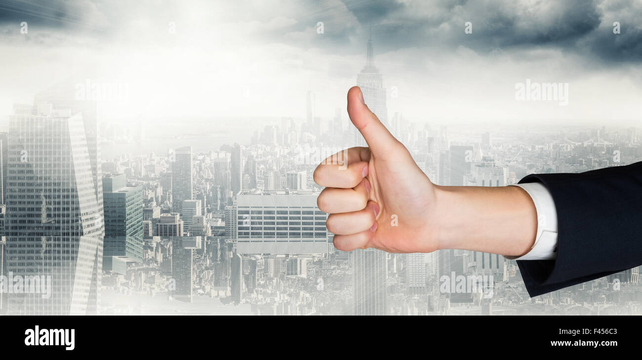 Composite image of hand showing thumbs up Stock Photo - Alamy