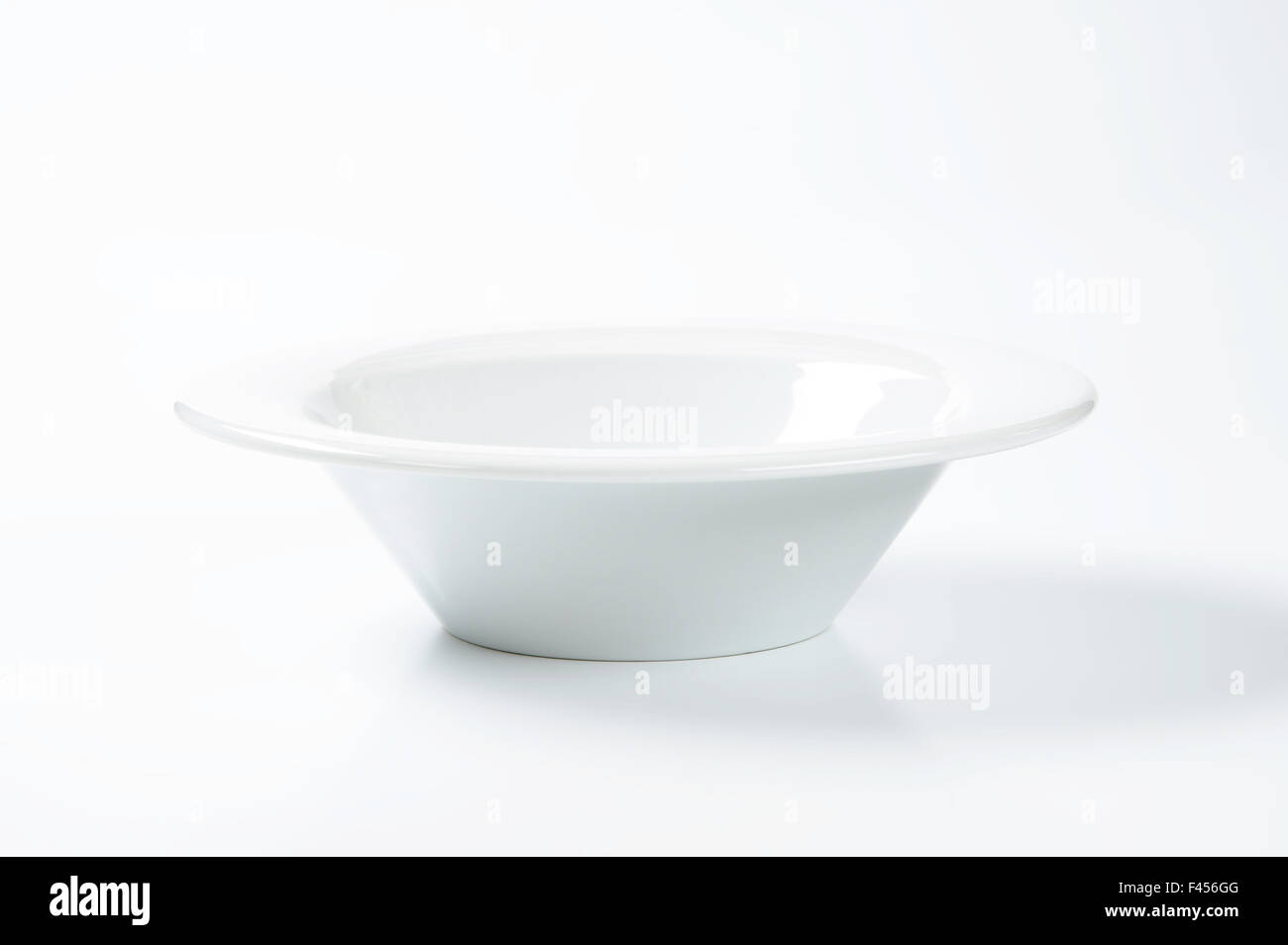 empty white soup plate on white background Stock Photo - Alamy
