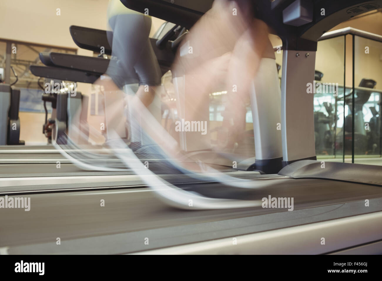 Fit people using the treadmill Stock Photo - Alamy