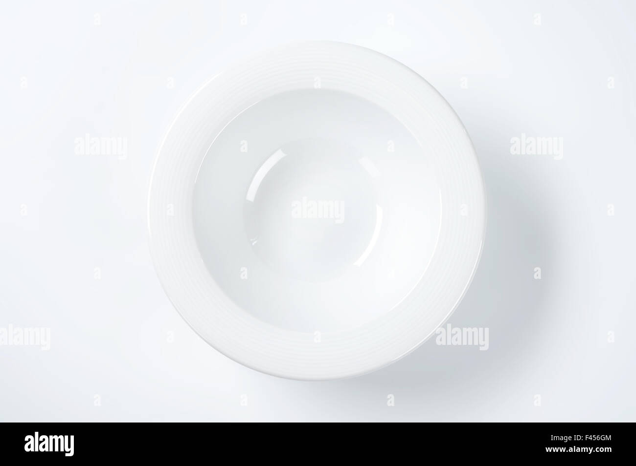 empty white soup plate on white background Stock Photo - Alamy