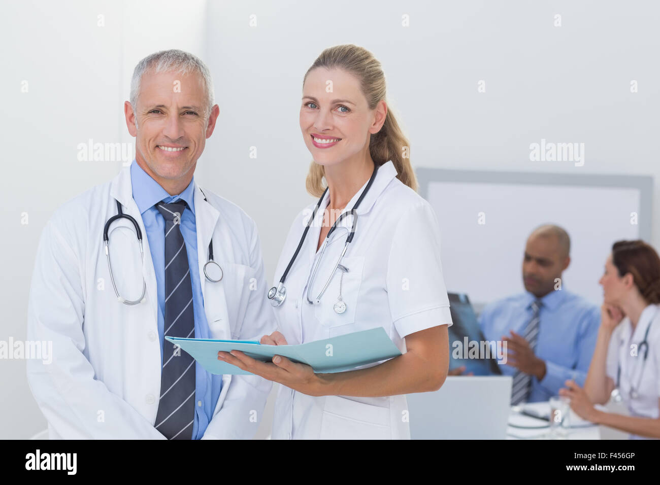 Team of doctors working on their files Stock Photo - Alamy