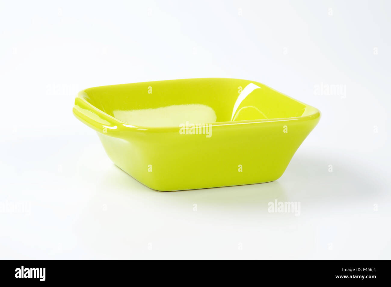 bright green baking tray on white background Stock Photo - Alamy
