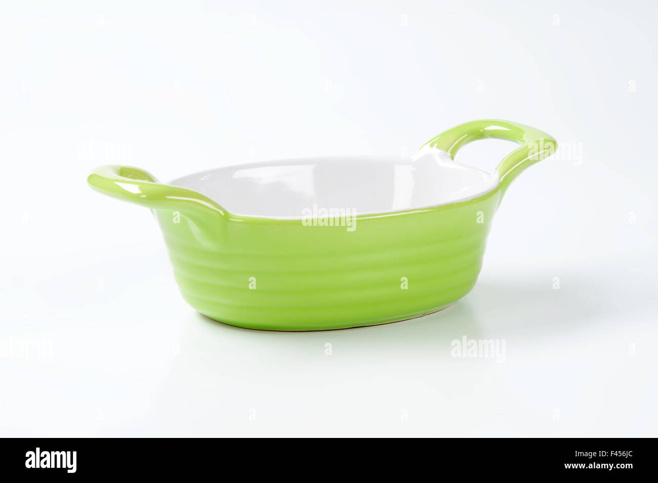 green casserole dish on white background Stock Photo - Alamy