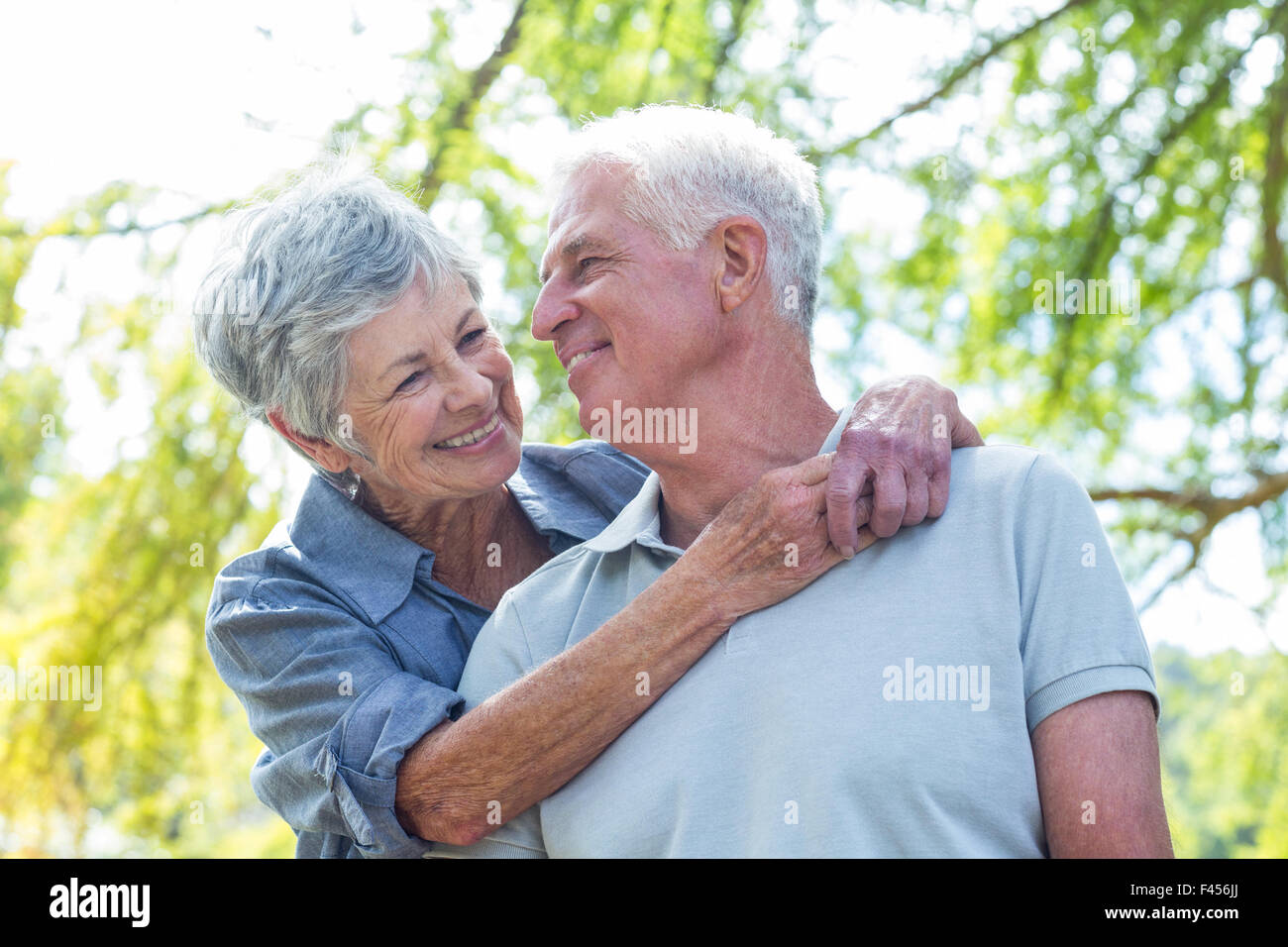 Happy old couple smiling Stock Photo - Alamy