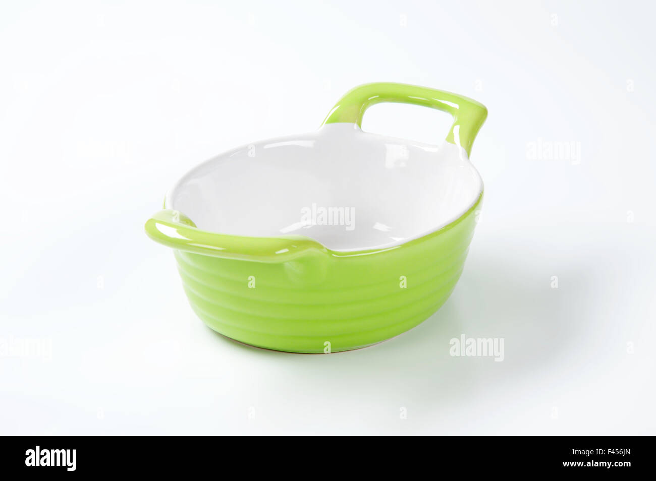 green casserole dish on white background Stock Photo - Alamy