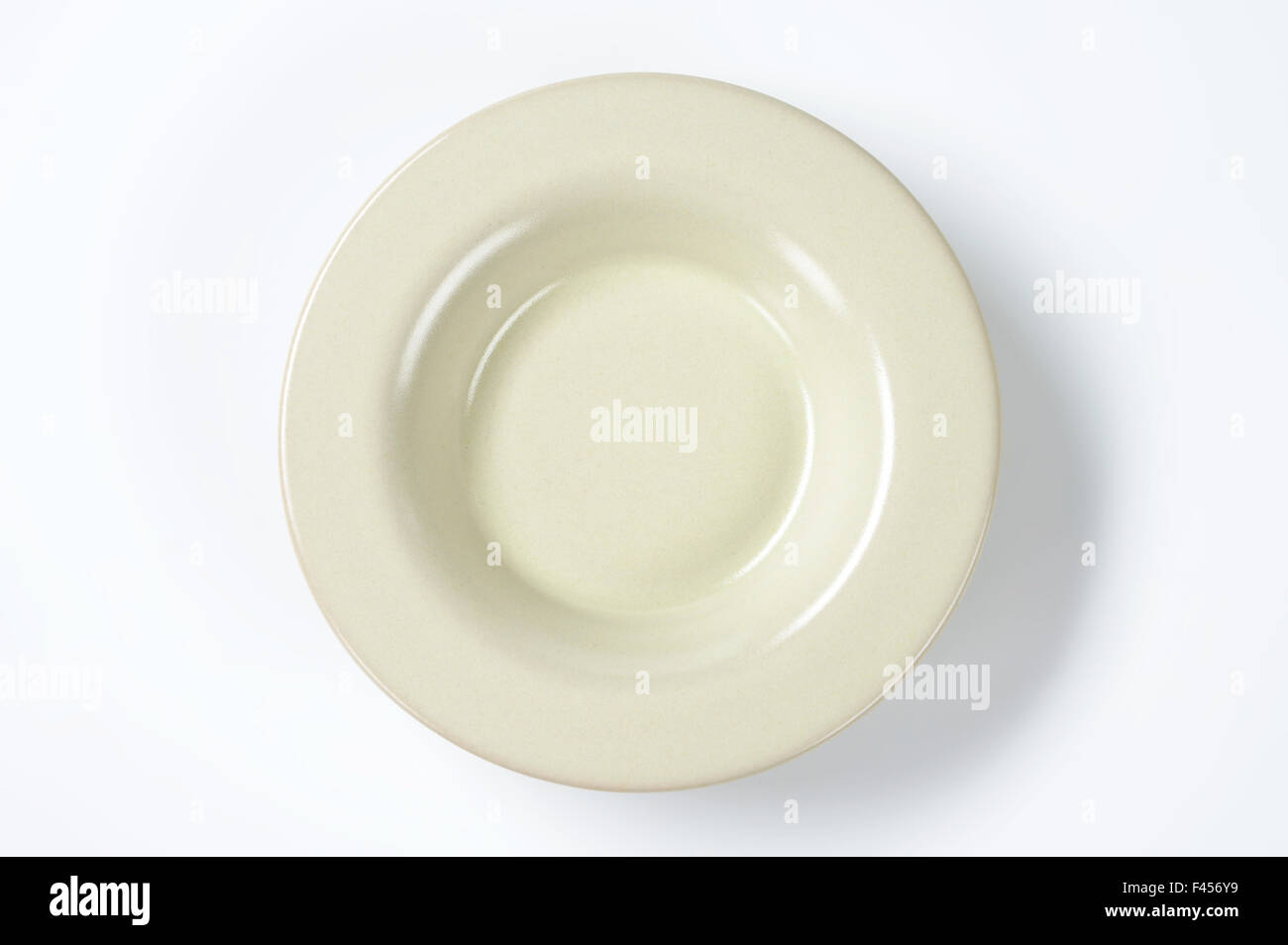 creamy soup plate on white background Stock Photo - Alamy