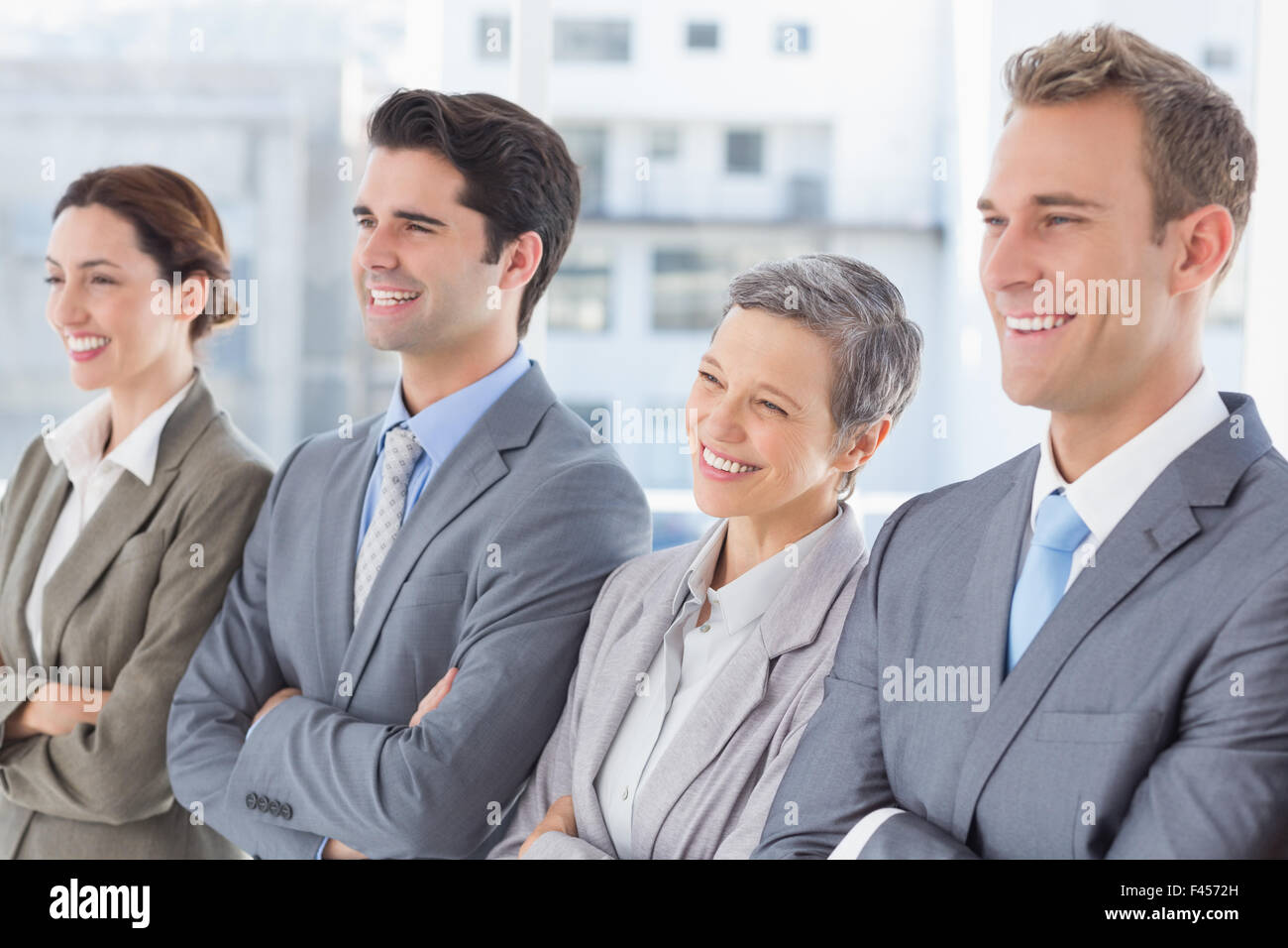 Business people standing in a row Stock Photo - Alamy