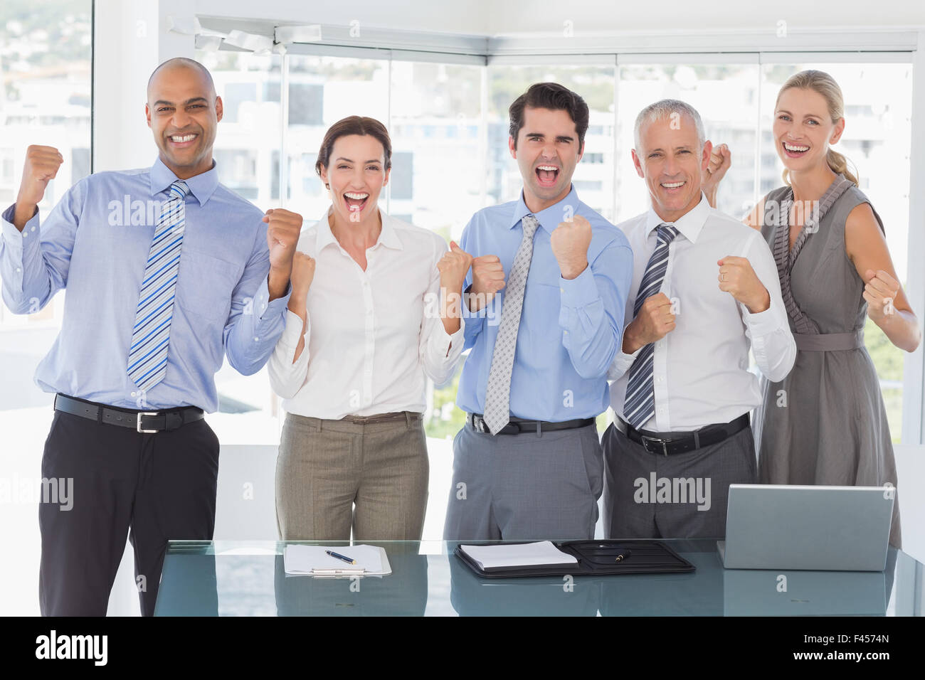 Business team celebrating a good job Stock Photo - Alamy