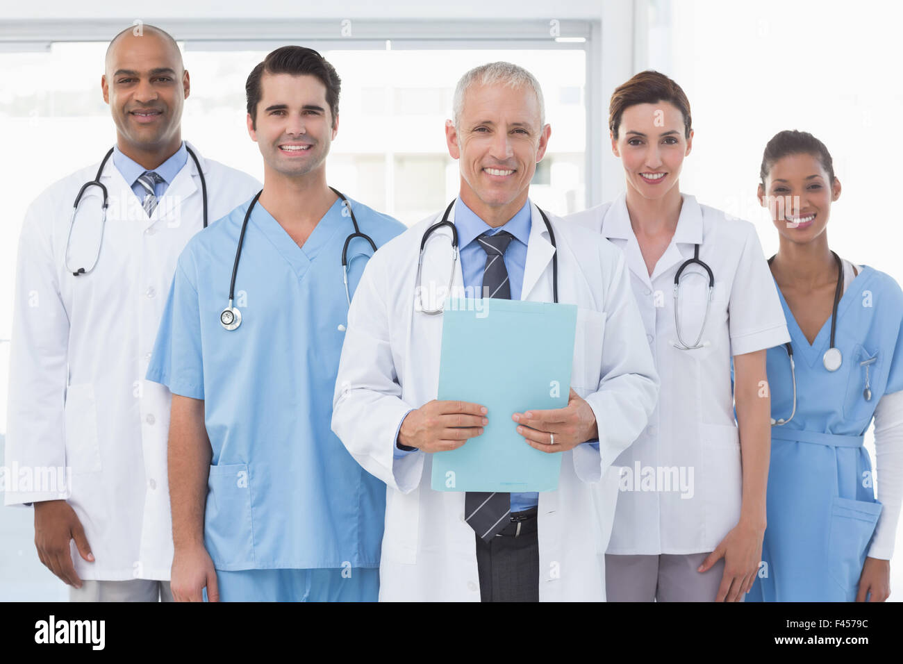 Team of smiling doctors looking at camera Stock Photo - Alamy
