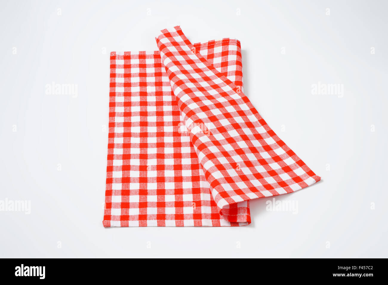red and white checkered napkin on white background Stock Photo - Alamy