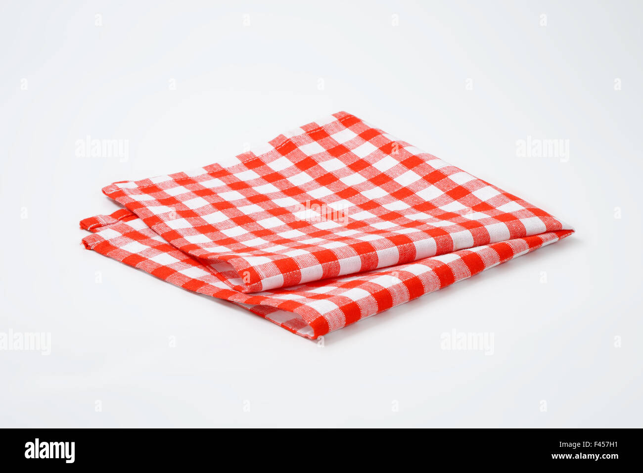 red and white checkered napkin on white background Stock Photo - Alamy