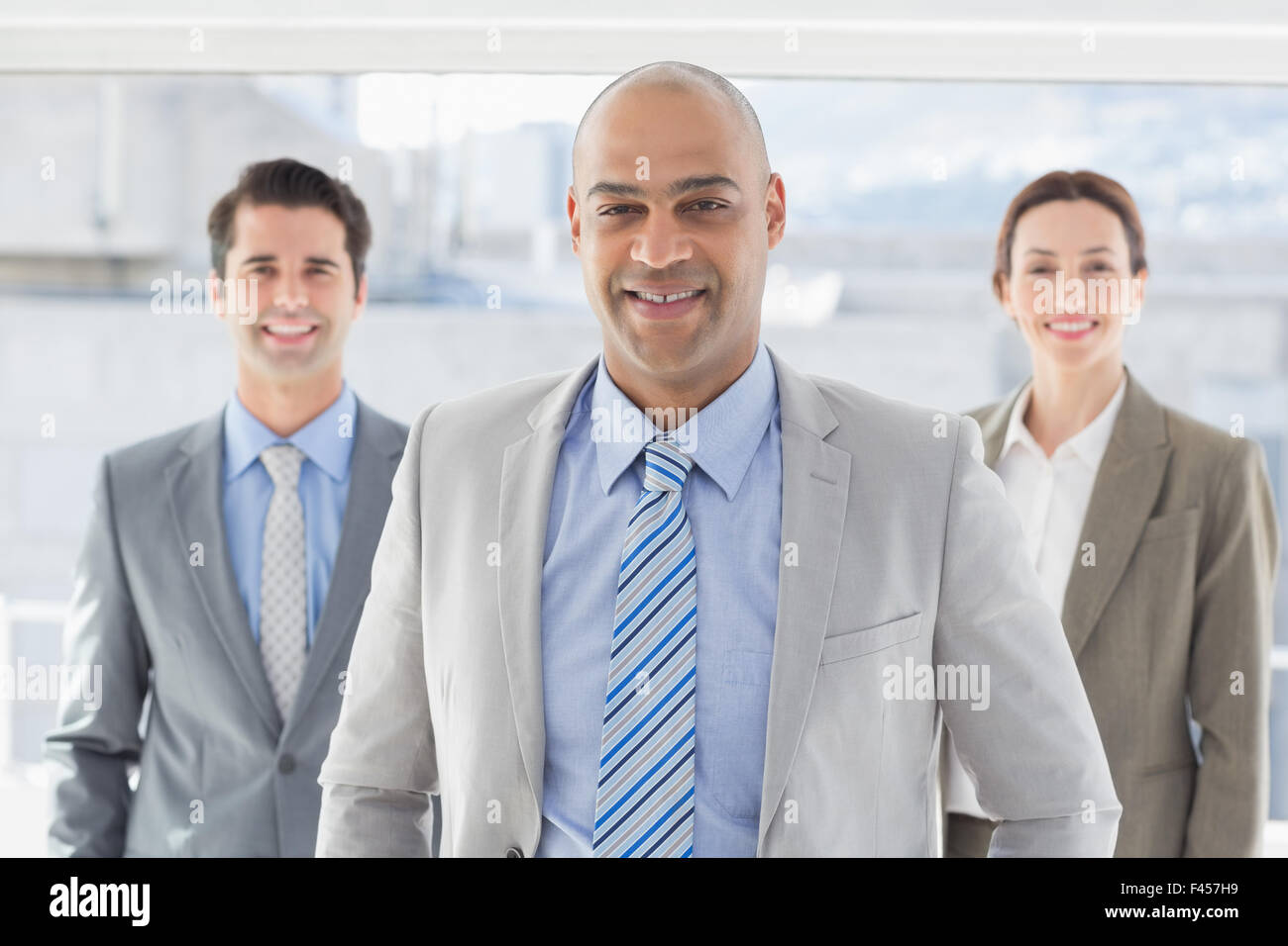 Business colleagues smiling at camera Stock Photo - Alamy