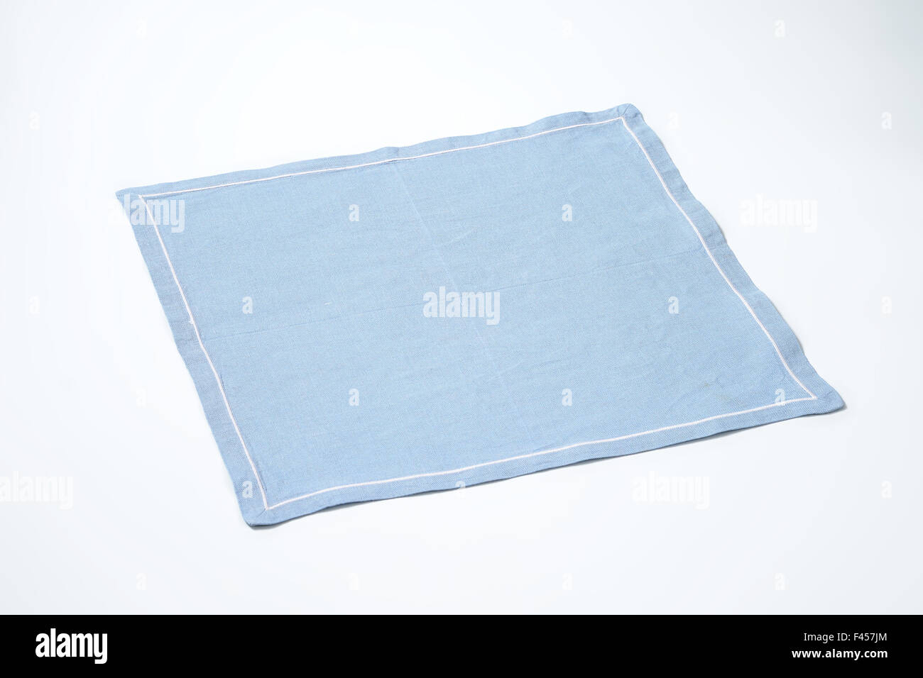 blue place mat on white background Stock Photo - Alamy