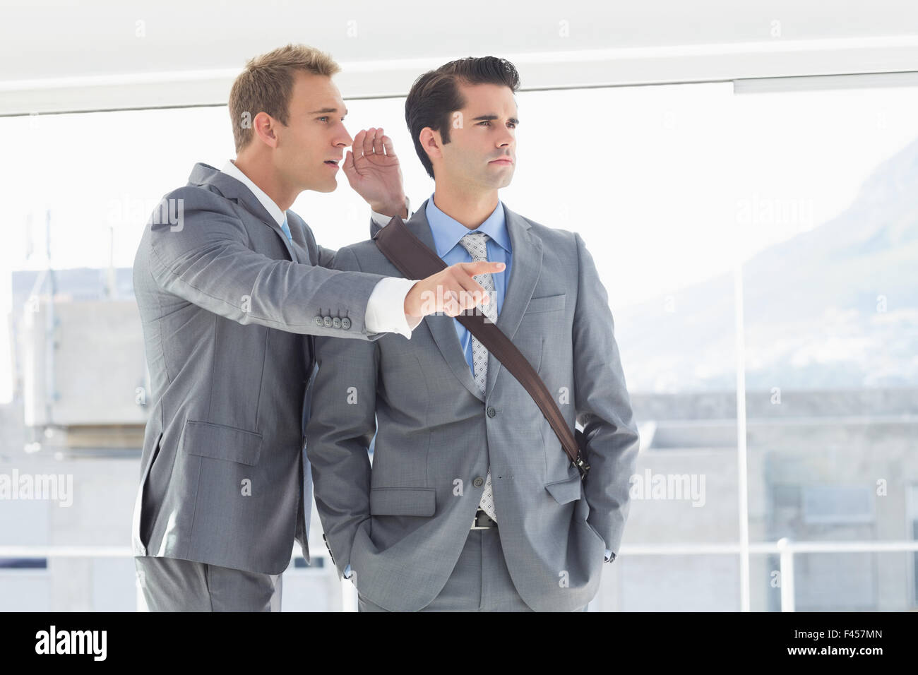 Businessman hiding secret hi-res stock photography and images - Alamy