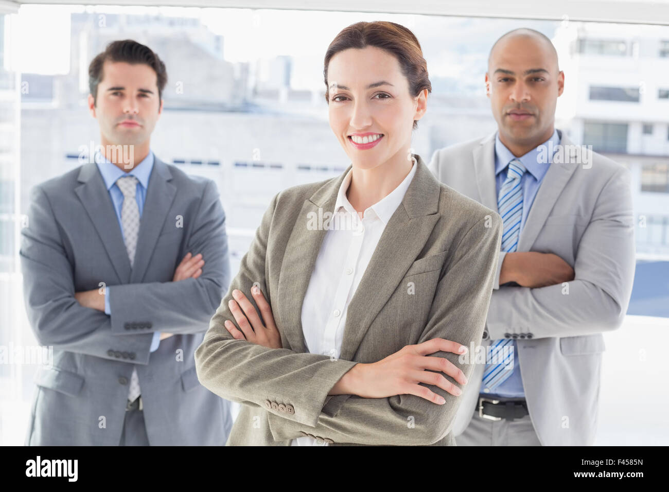 Business colleagues smiling at camera Stock Photo - Alamy