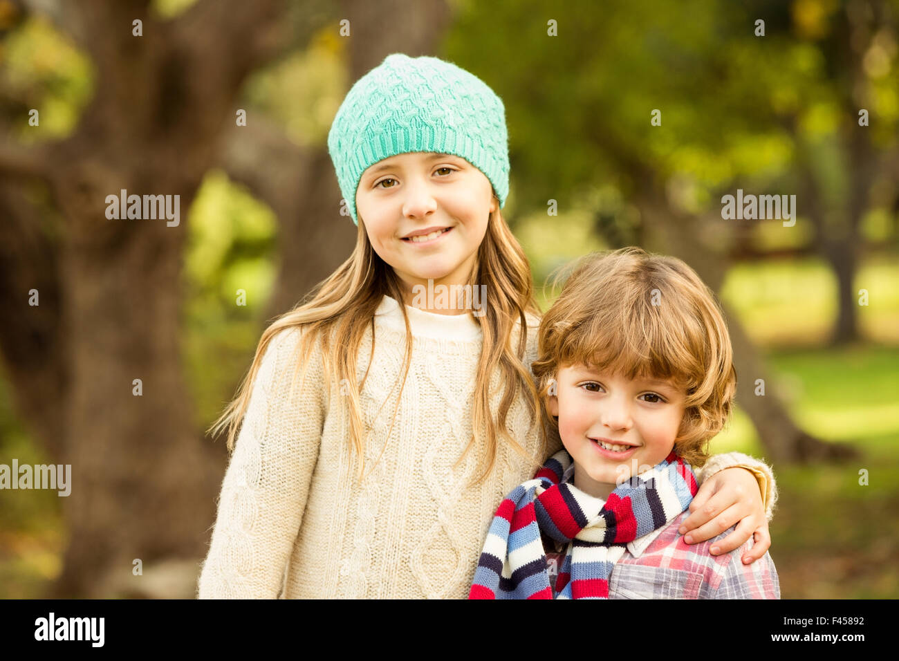 Happy siblings in the park Stock Photo - Alamy