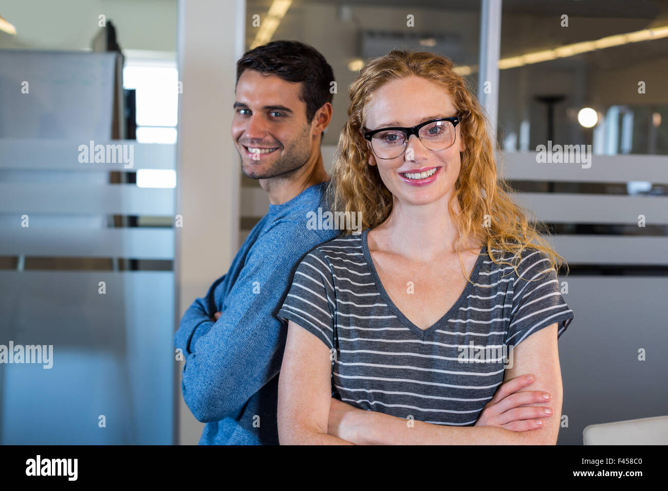 Portrait of smiling partners posing together Stock Photo - Alamy