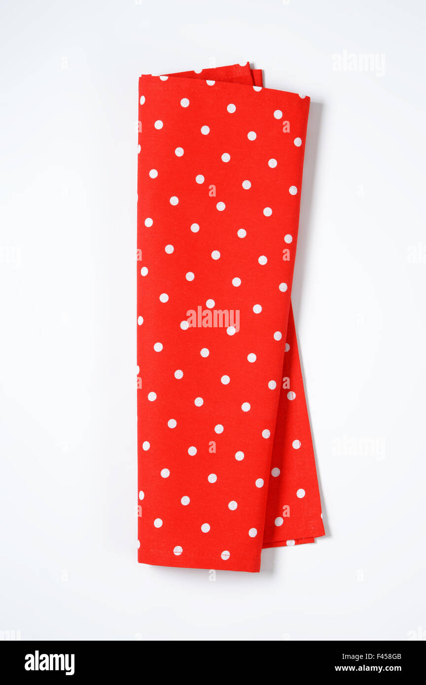 red and white dotted place mat on white background Stock Photo - Alamy