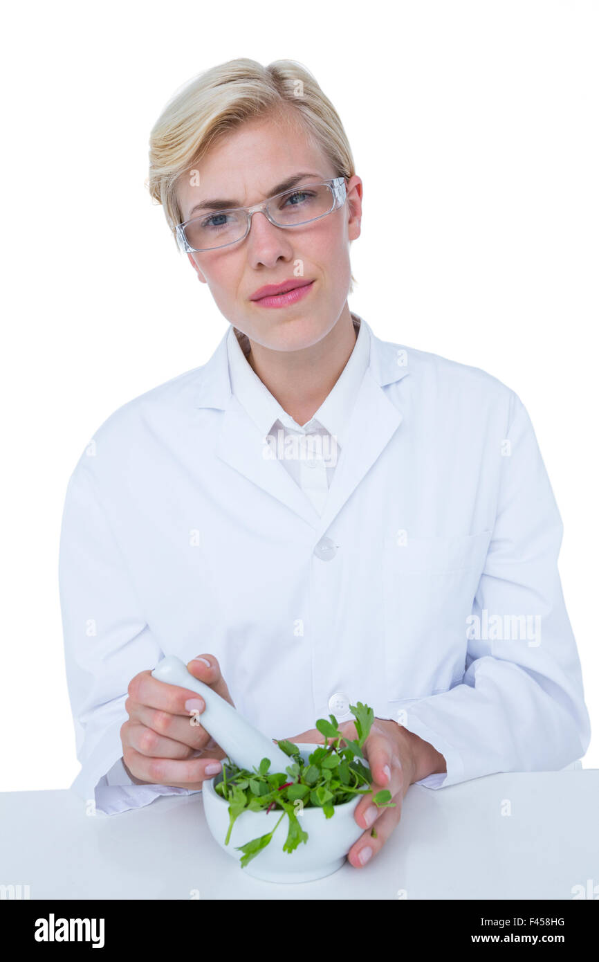 Doctor mixing herbs with mortar and pestle Stock Photo - Alamy