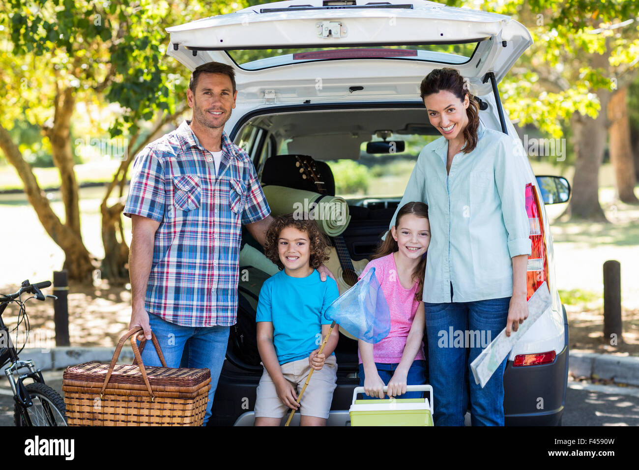 Happy family getting ready for road trip Stock Photo - Alamy