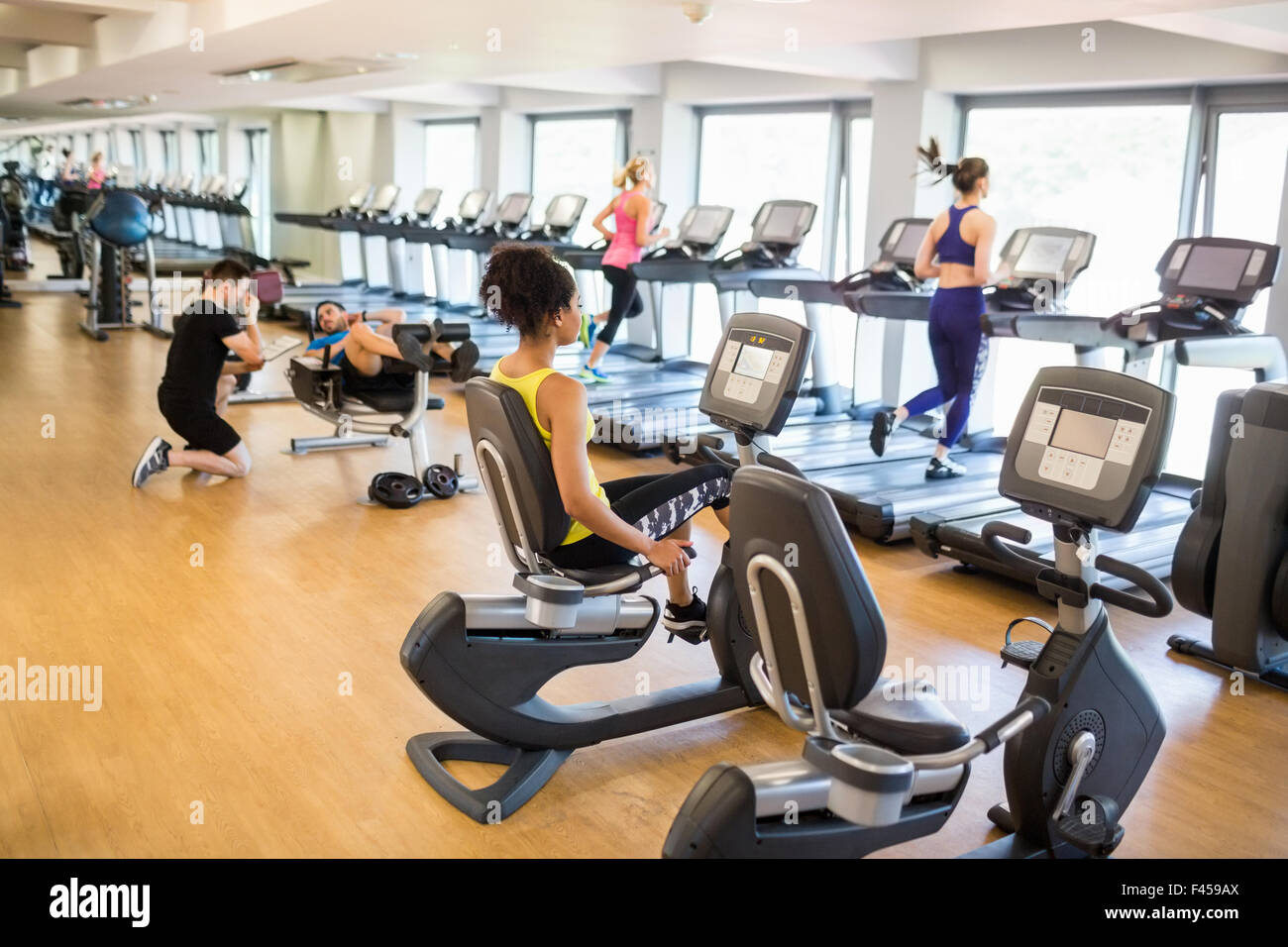 Fit people working out using machines Stock Photo - Alamy