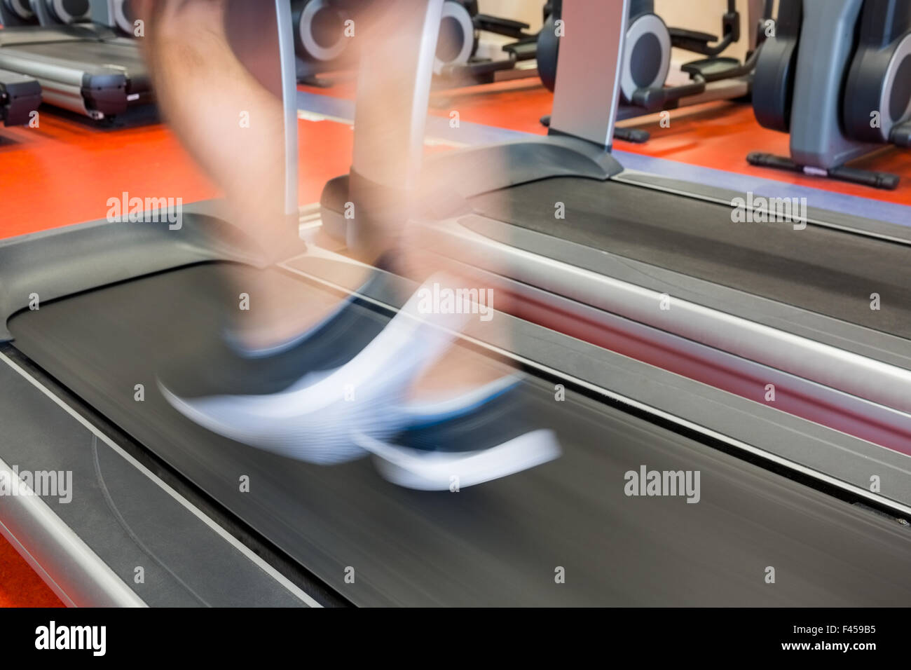 Man running on a treadmill Stock Photo - Alamy