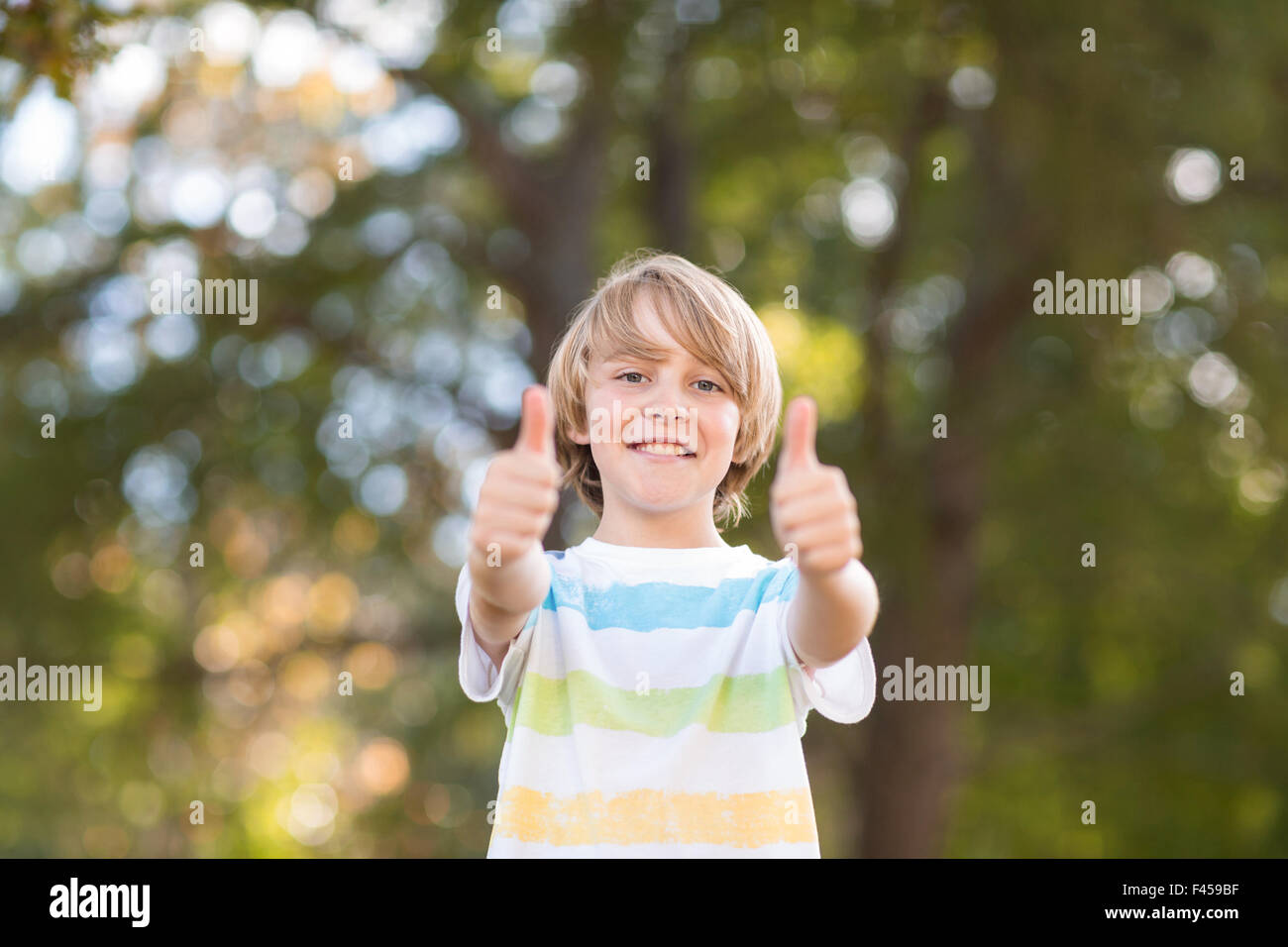 Happy boy smiling at camera Stock Photo - Alamy