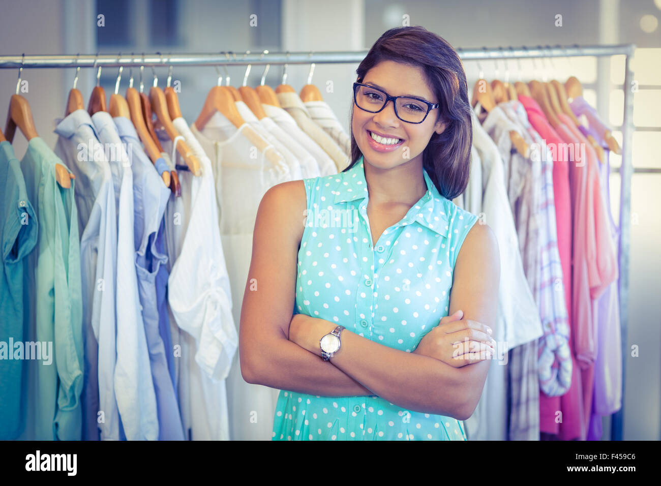 Happy shopper smiling at camera Stock Photo - Alamy