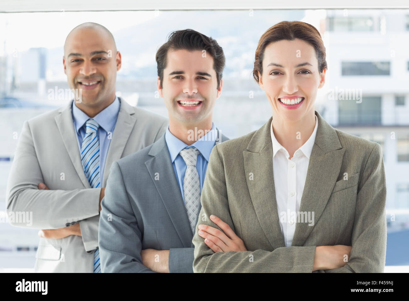 Business colleagues smiling at camera Stock Photo - Alamy