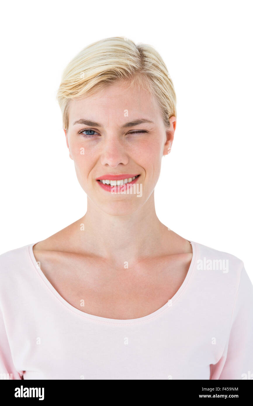 Attractive blonde woman winking Stock Photo - Alamy