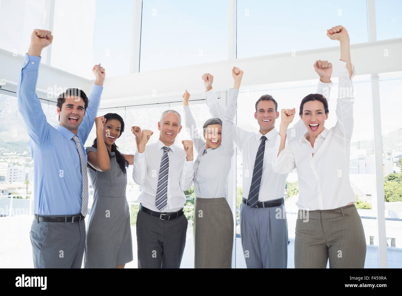 Business team celebrating a good job Stock Photo - Alamy
