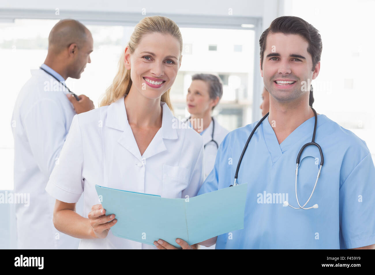 Team of doctors working on their files Stock Photo - Alamy