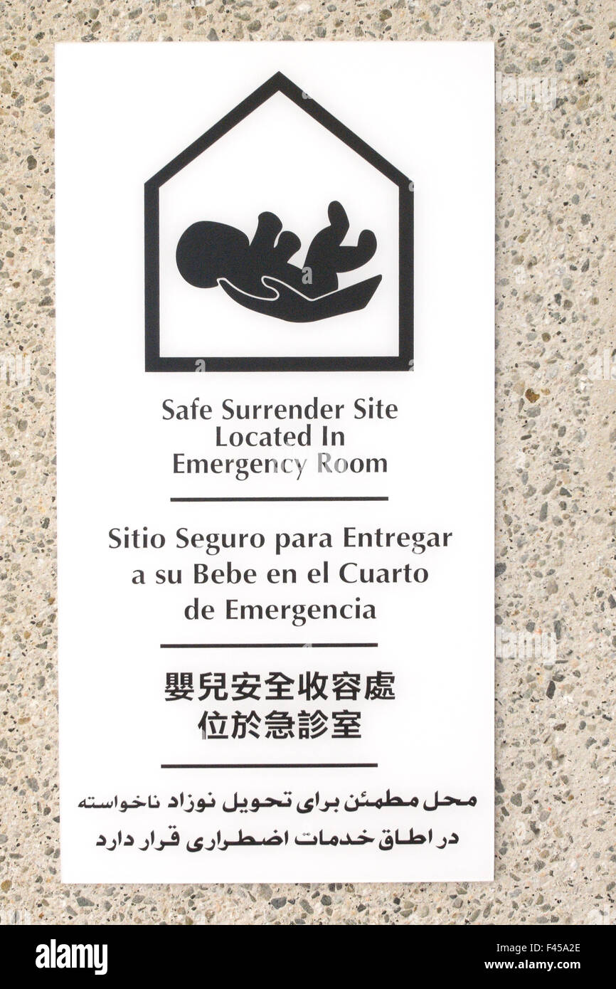 A sign in four languages outside an Irvine, CA, hospital acknowledges a ...