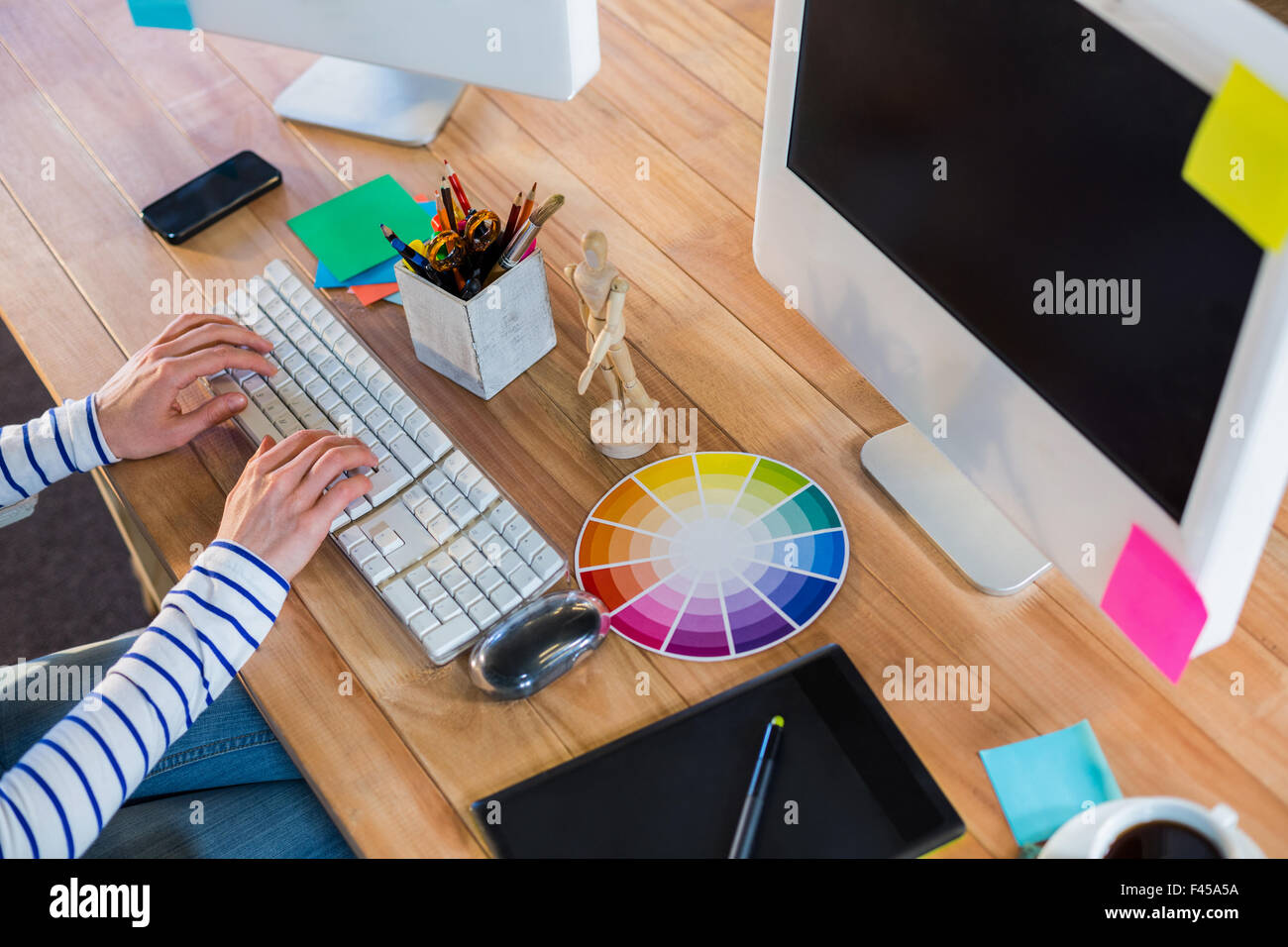 Designer typing on keyboard Stock Photo - Alamy