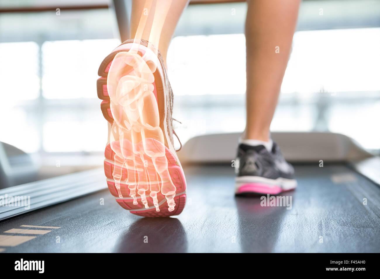 Highlighted foot of woman on treadmill Stock Photo - Alamy