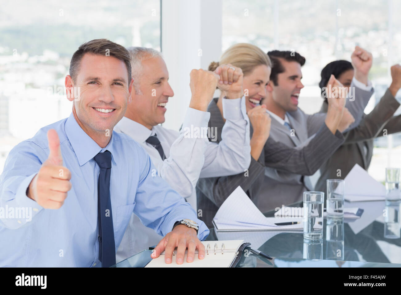 Business team celebrating a good job Stock Photo - Alamy