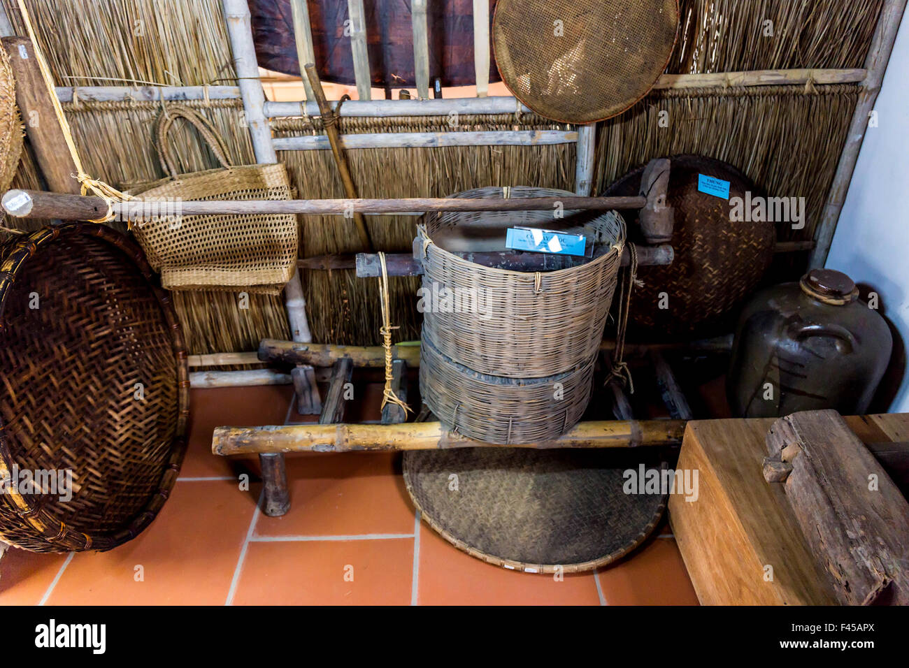Ancient Vietnamese farming and fishing tools on display Stock Photo - Alamy