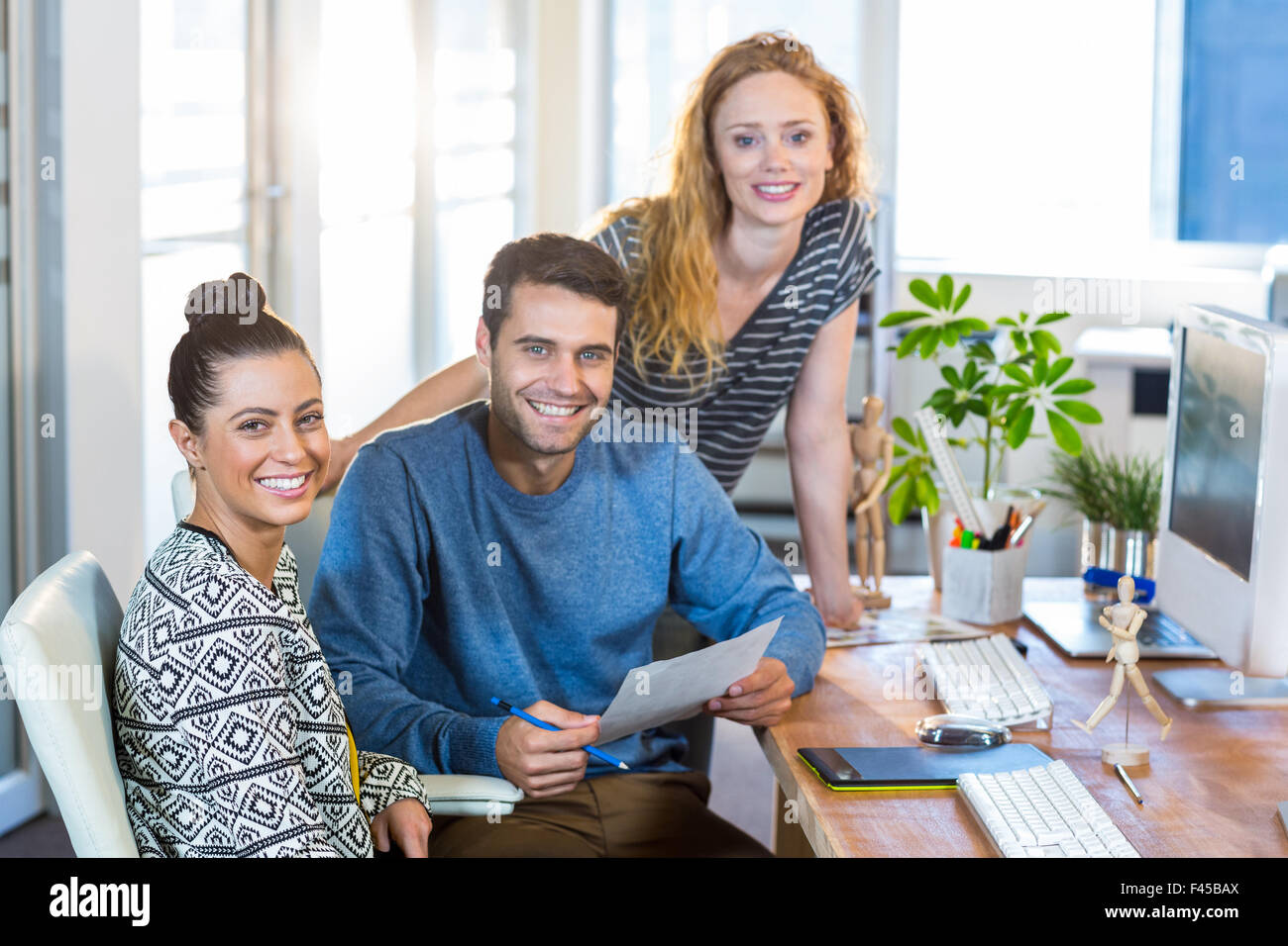 Professional designers smiling at camera Stock Photo - Alamy Professional designers smiling at camera Stock Photo - Alamy