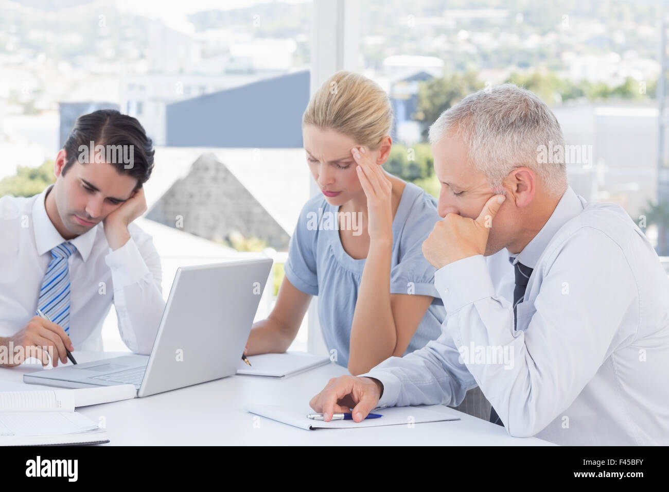 Concentrated business team working together Stock Photo - Alamy