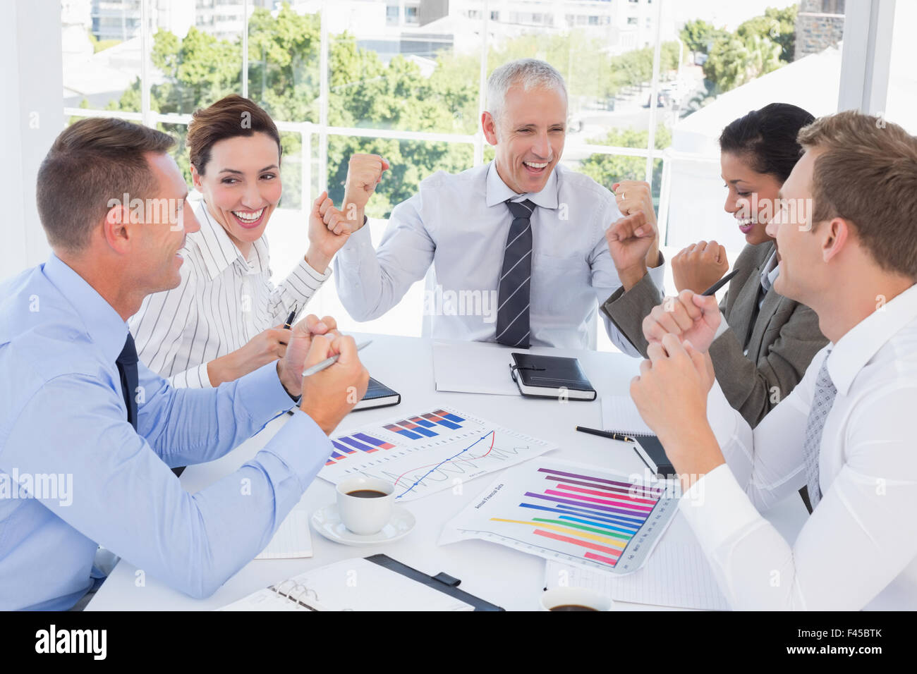 Business team celebrating a good job Stock Photo - Alamy