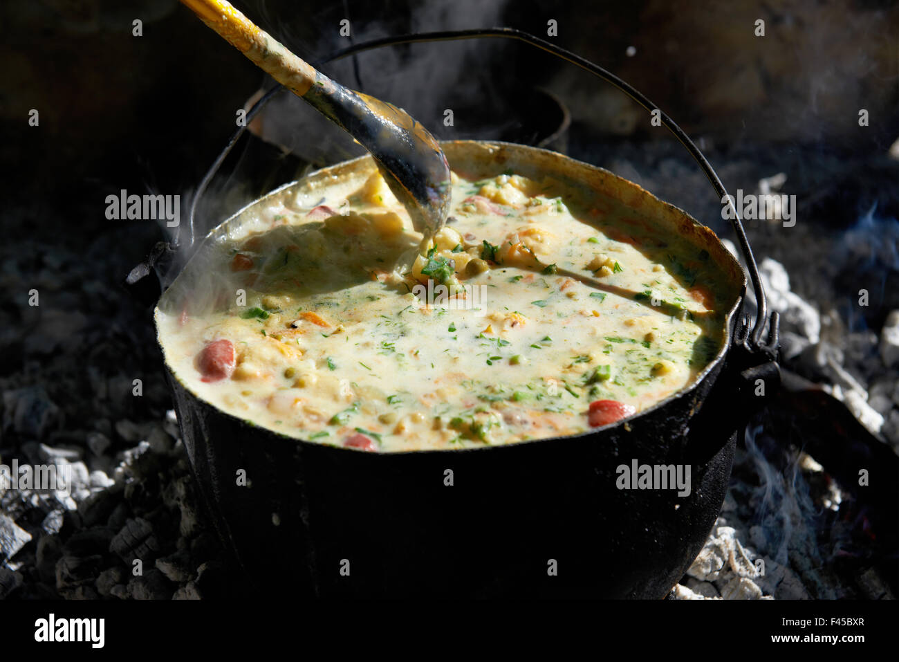 Boiling soup in a pot Stock Photo - Alamy