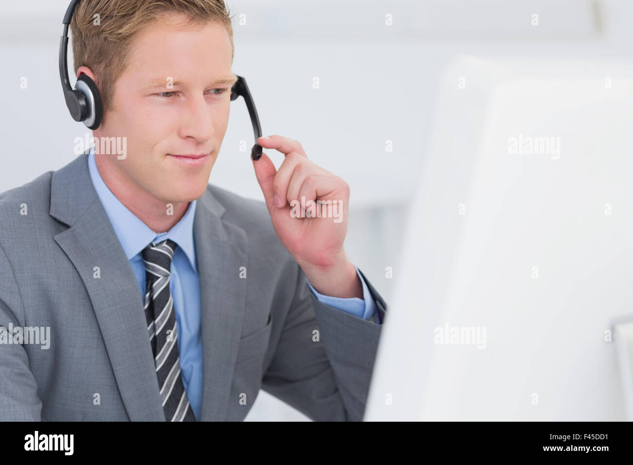 Handsome agent wearing headset Stock Photo - Alamy