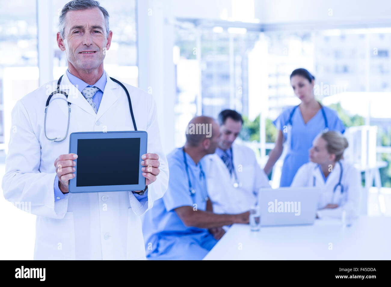 Doctor showing digital table hi-res stock photography and images - Alamy