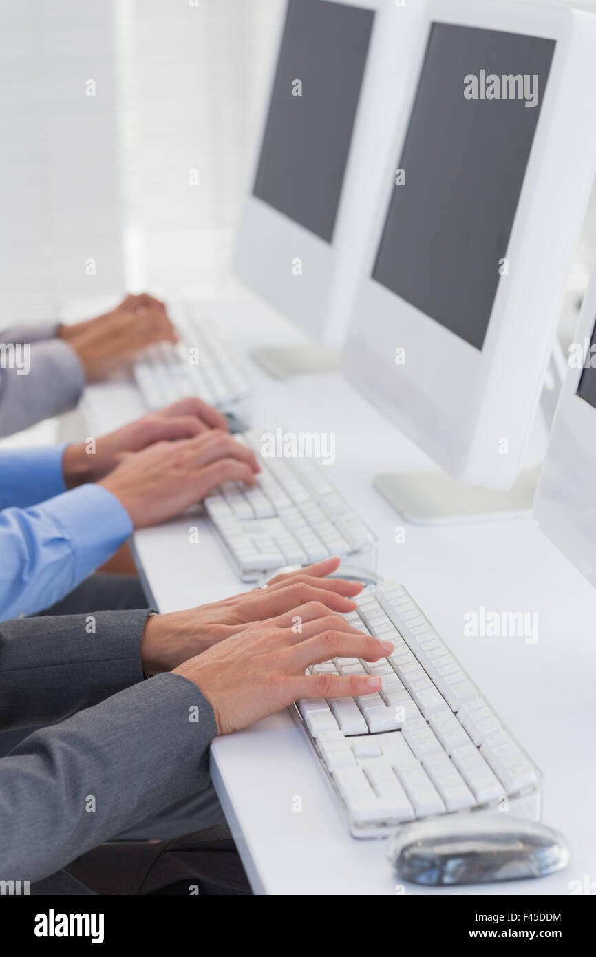 Business team working on computers Stock Photo - Alamy