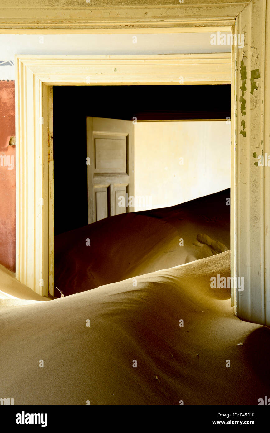 Abandoned house full of sand. Kolmanskop Ghost Town, an old diamond ...