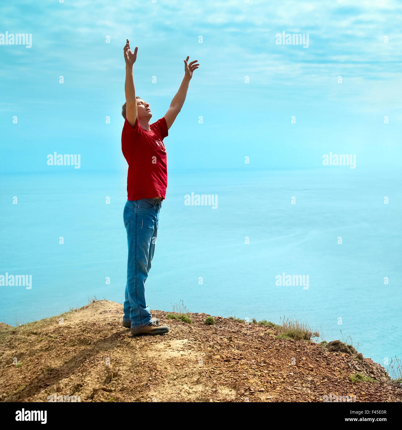 Happy man on the cliff Stock Photo - Alamy