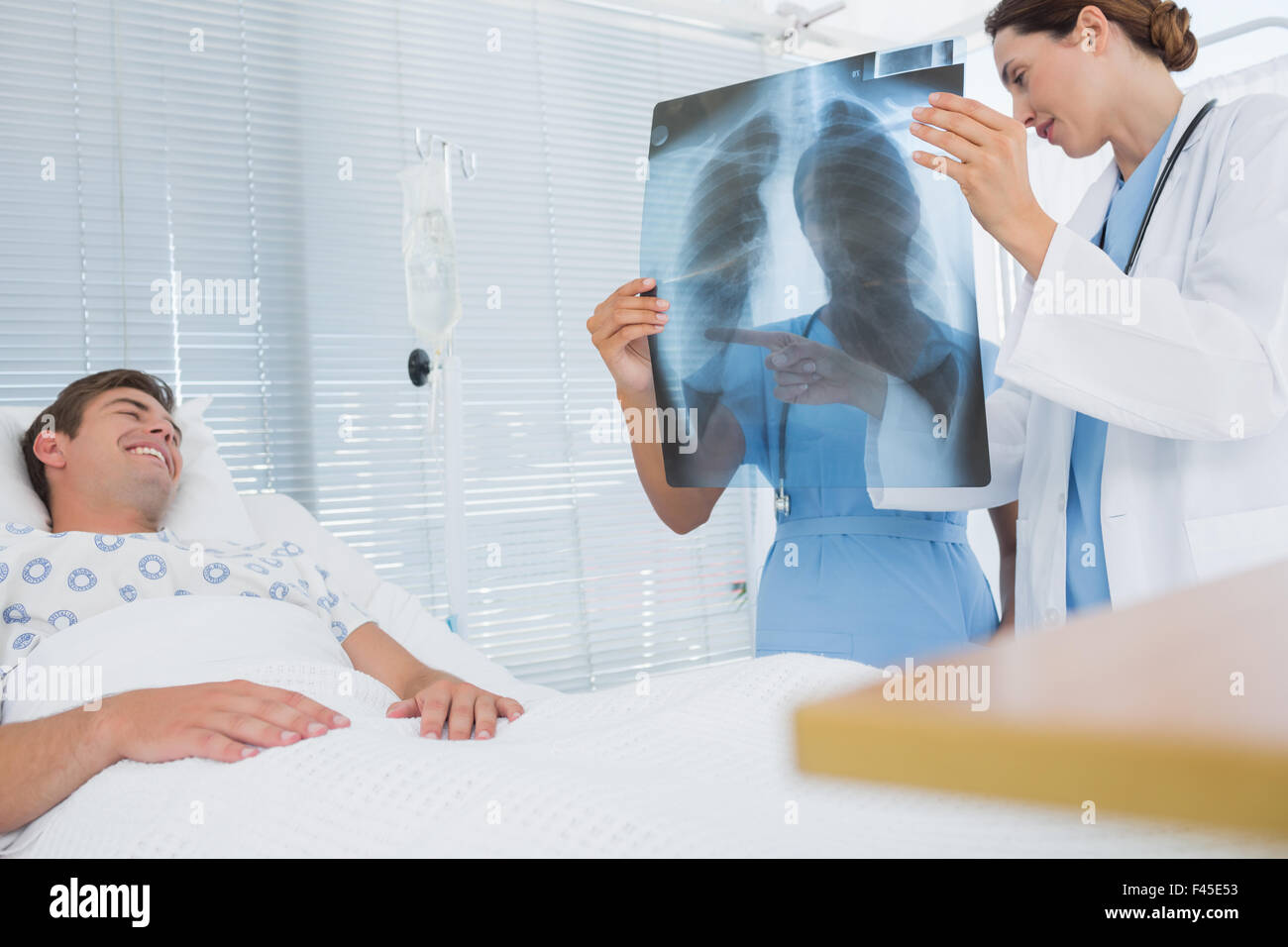 Doctors examining patients xray Stock Photo - Alamy